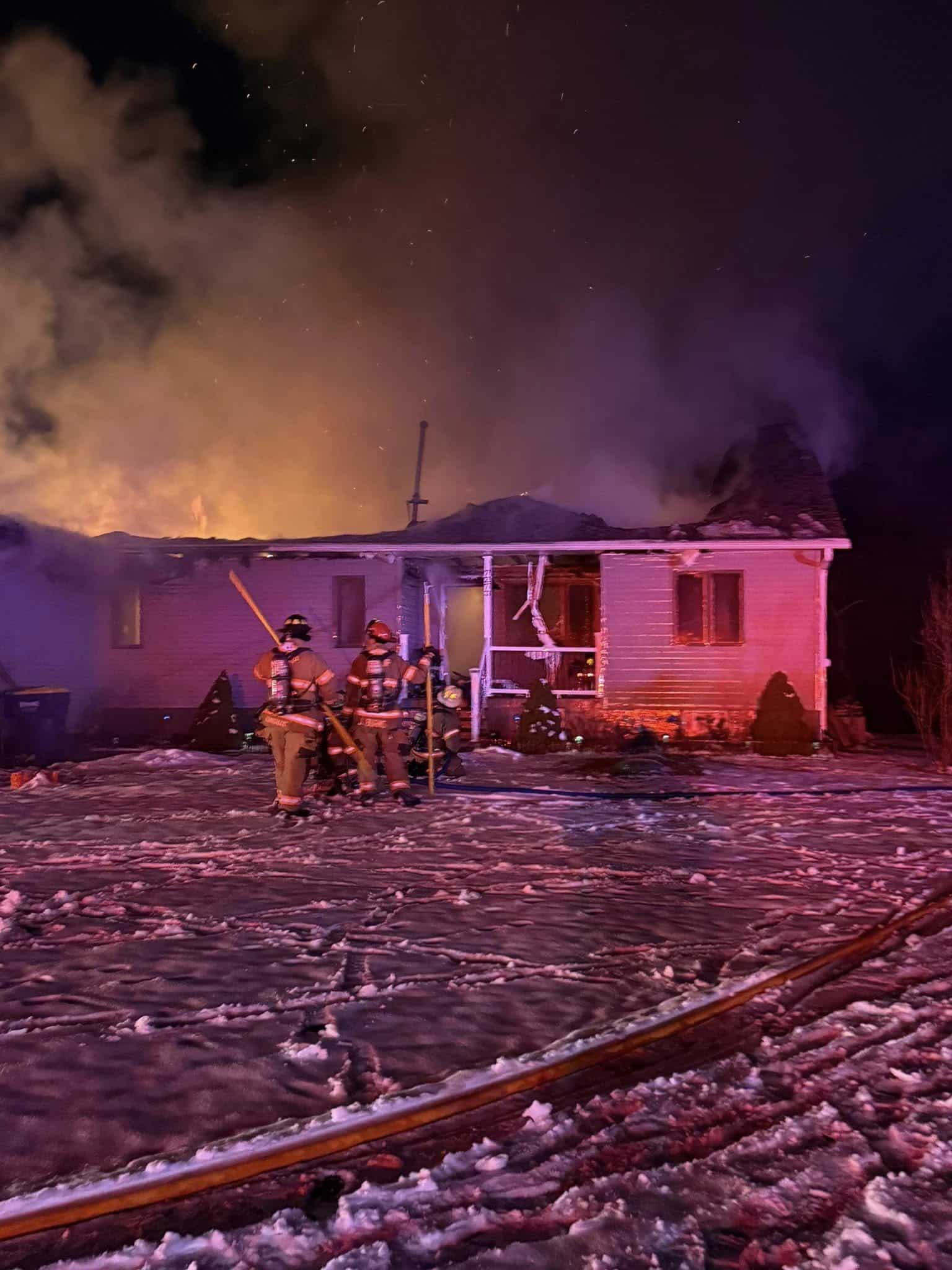 House fire in Throop leaves three displaced, sparks massive response